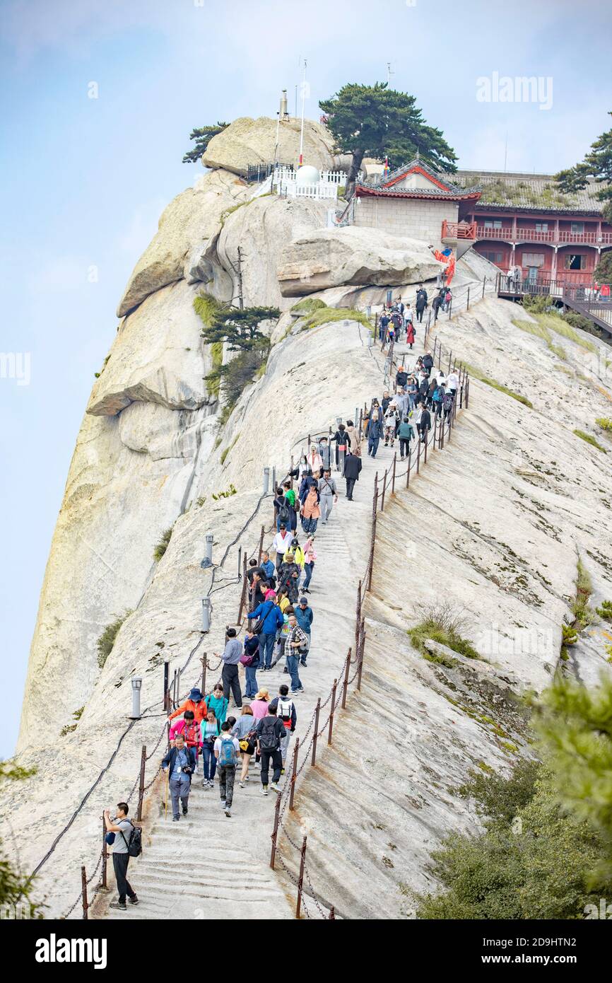 Tourists climb the Mount Hua, the western mountain of the Five Great ...