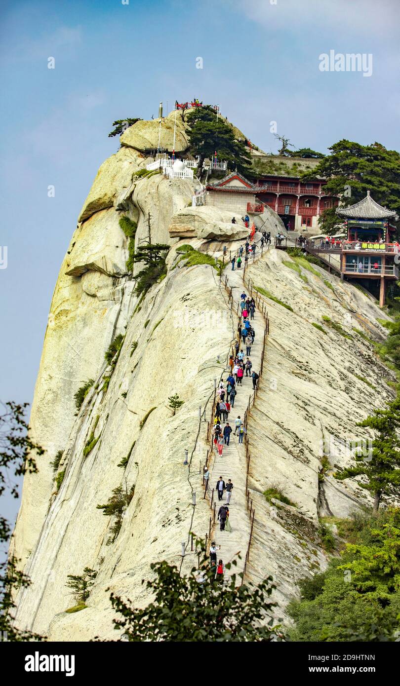 Tourists climb the Mount Hua, the western mountain of the Five Great ...