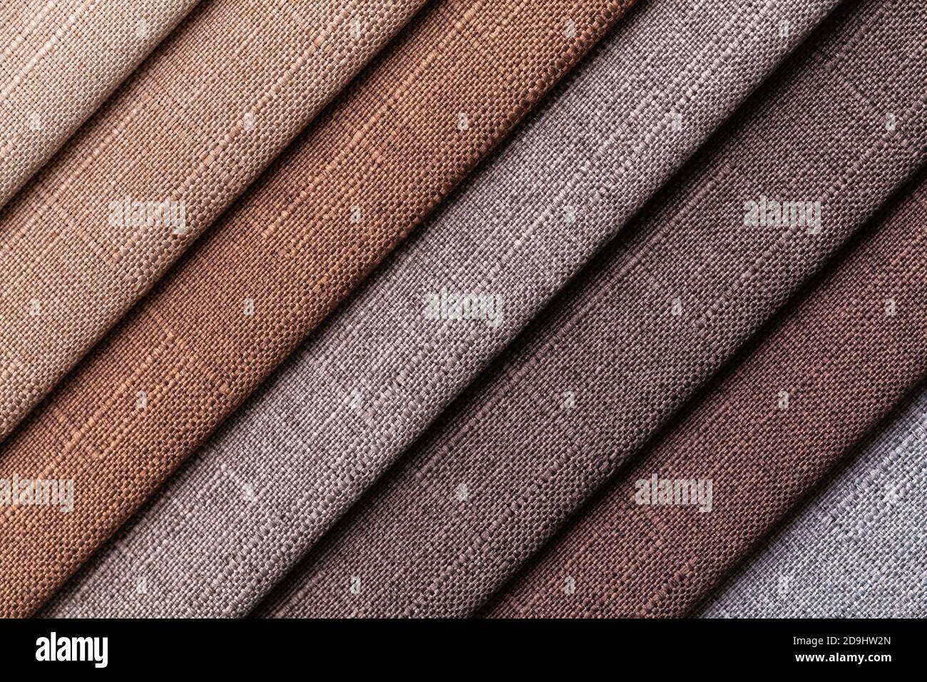 Sample of woven textile brown and gray colors, background. Catalog and ...
