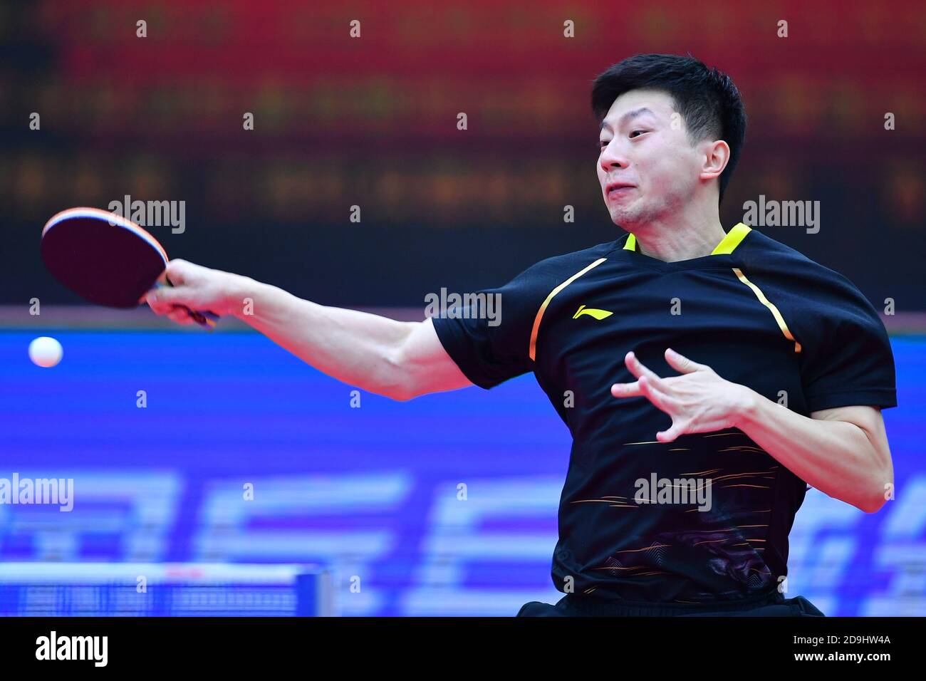 Chinese table tennis player Ma Long competes against Chinese table ...