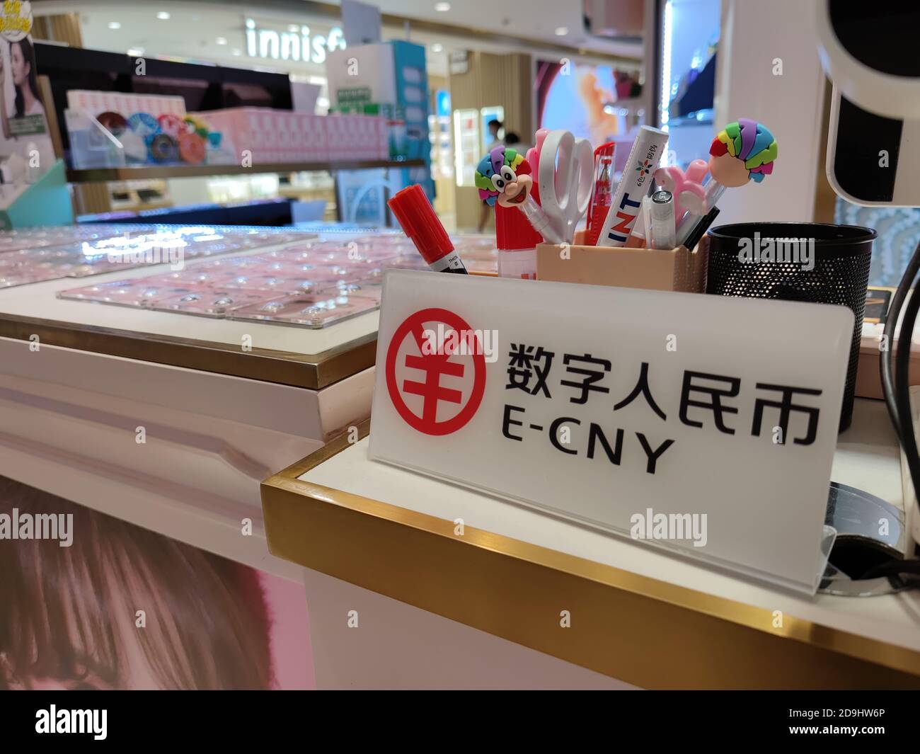 An E-CNY payment sign is put up on a desk in a store in the Luohu ...