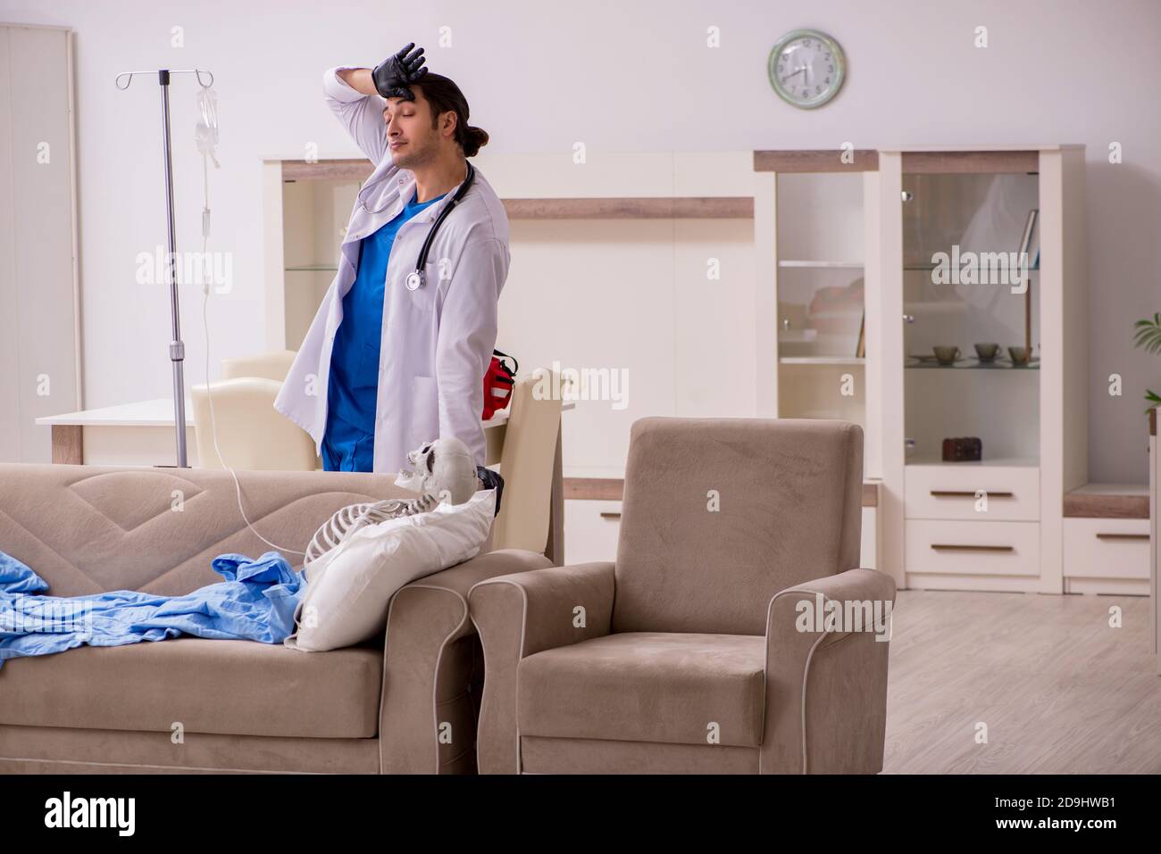 Male paramedic visiting skeleton patient Stock Photo - Alamy