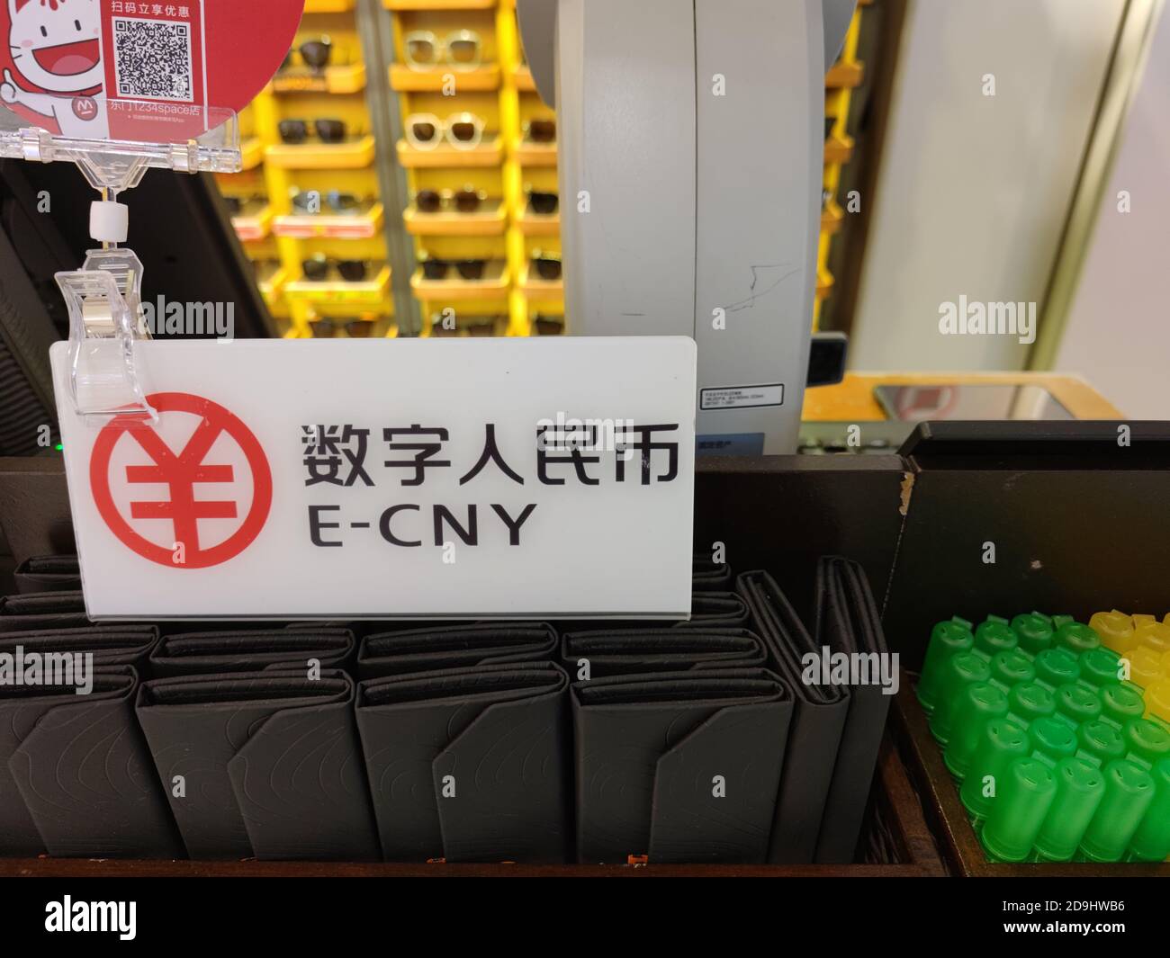 An E-CNY payment sign is put up on a desk in a store in the Luohu ...