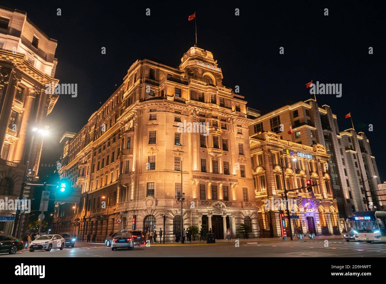 The exotic buildings with yellow light on stand along the Huangpu River ...