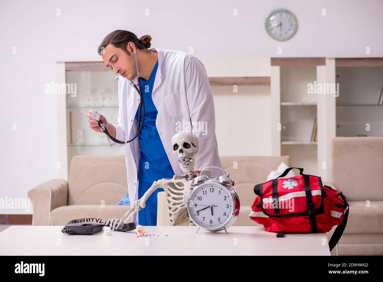 Male paramedic visiting skeleton patient Stock Photo - Alamy