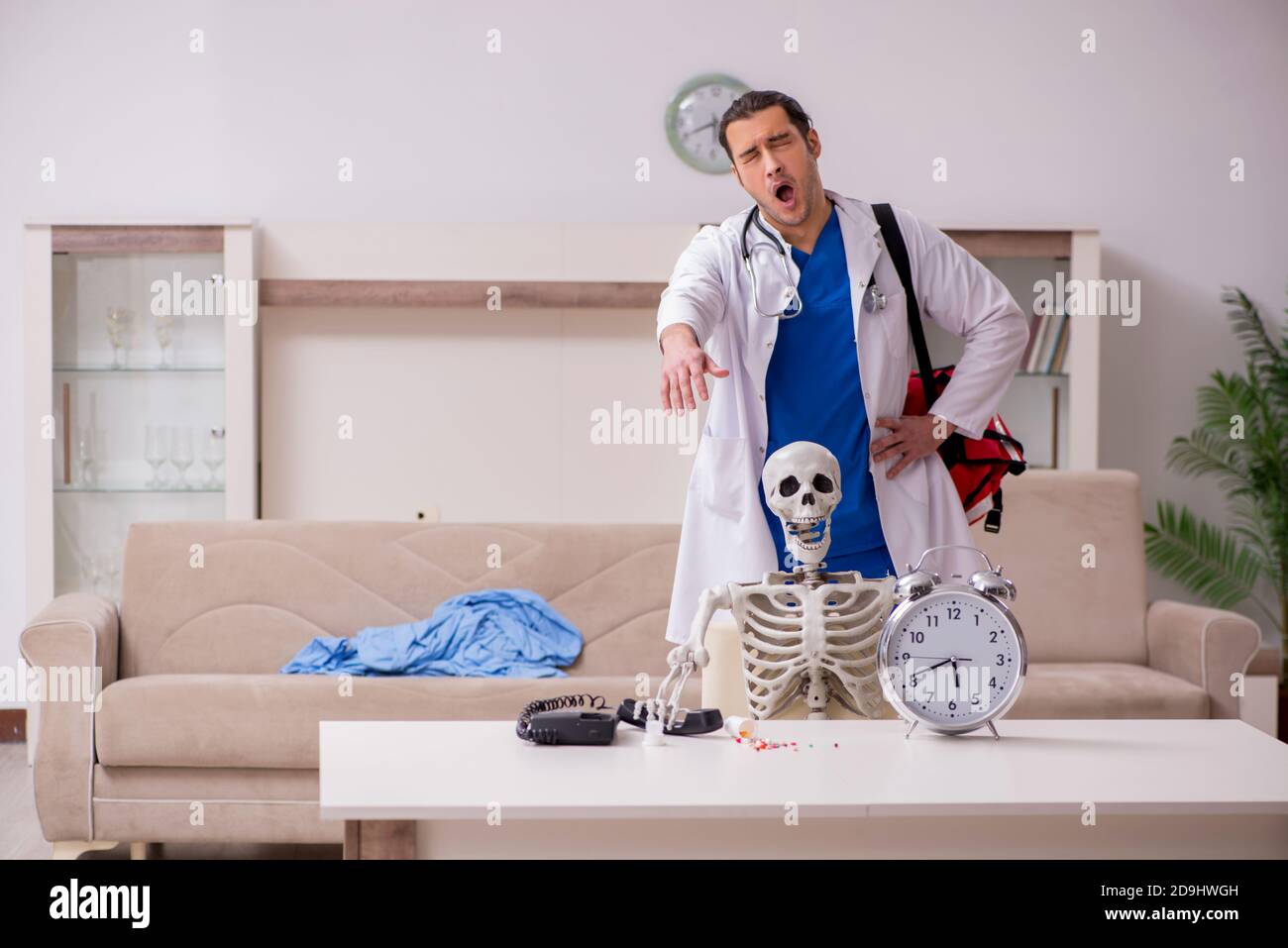 Male paramedic visiting skeleton patient Stock Photo - Alamy