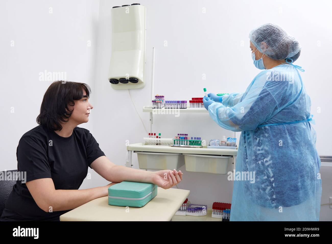 Nurse taking blood sample to make a test in laboratory Stock Photo - Alamy