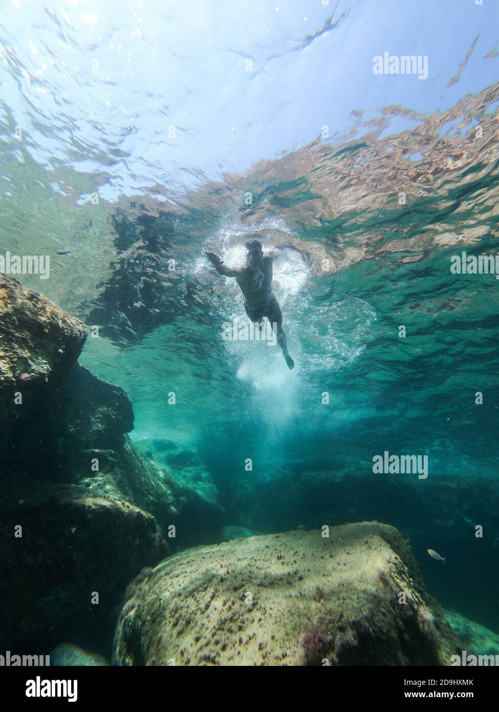 Man swimming in the sea. View from inside the water Stock Photo - Alamy