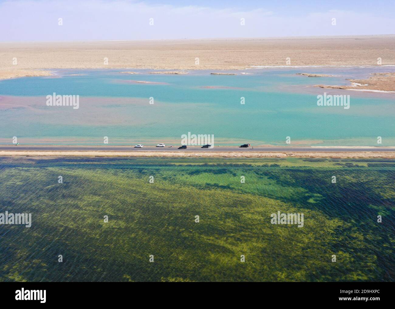 Aerial view of the °most beautiful highway over lake" in Dachaidan Town ...