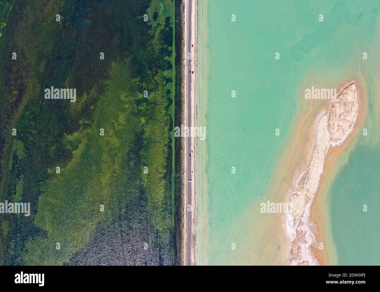 Aerial view of the °most beautiful highway over lake" in Dachaidan Town ...