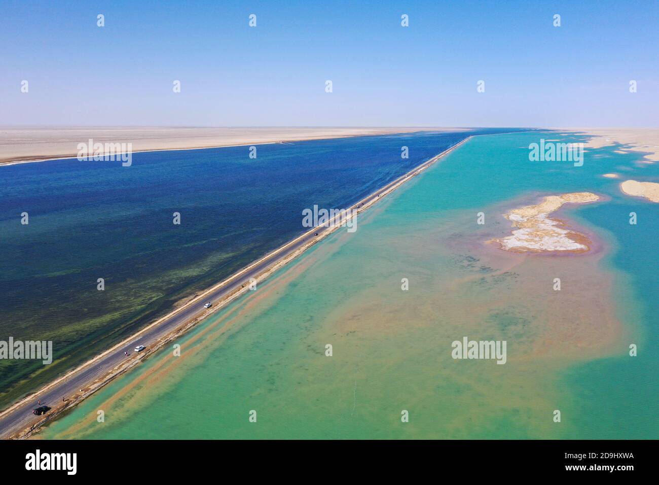 Aerial view of the °most beautiful highway over lake" in Dachaidan Town ...