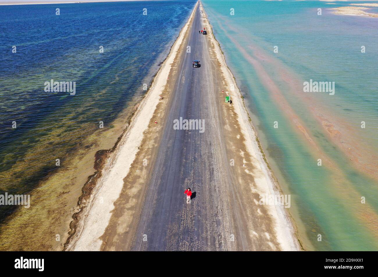 Aerial view of the °most beautiful highway over lake" in Dachaidan Town ...