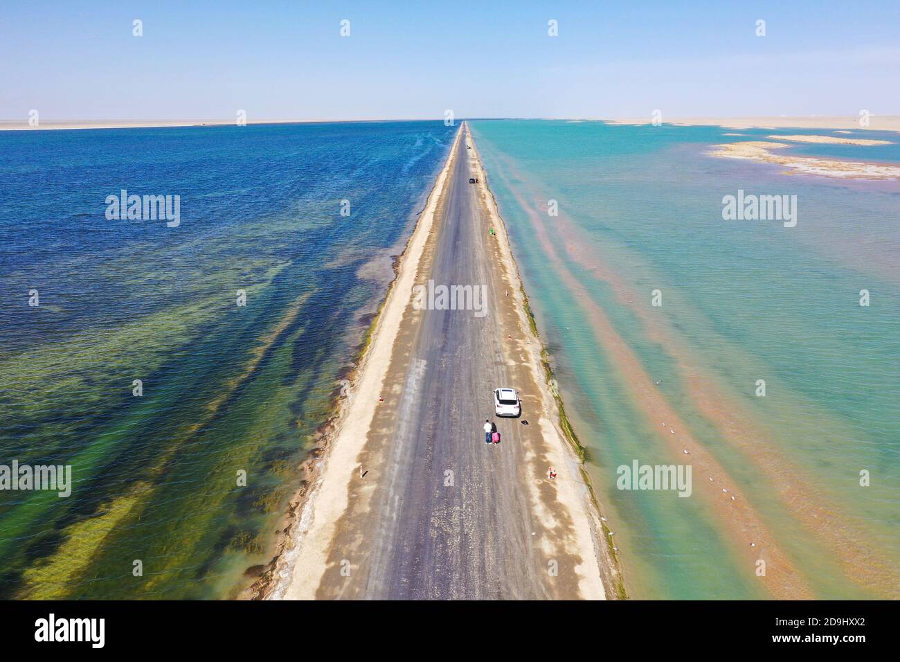Aerial view of the °most beautiful highway over lake" in Dachaidan Town ...