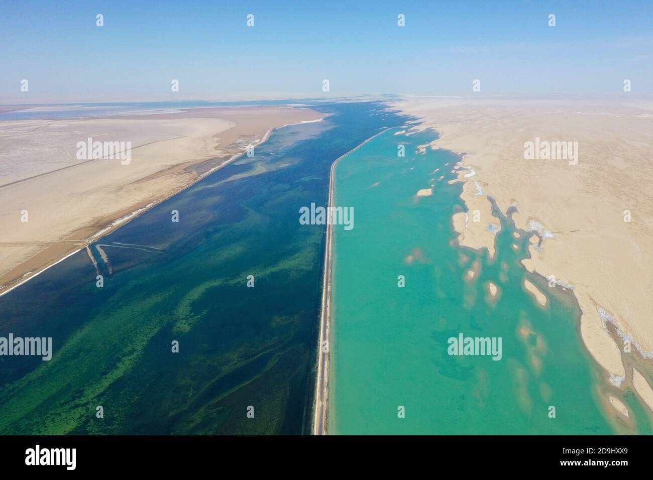 Aerial view of the °most beautiful highway over lake" in Dachaidan Town ...