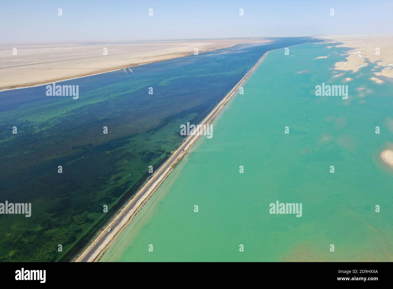 Aerial view of the °most beautiful highway over lake" in Dachaidan Town ...