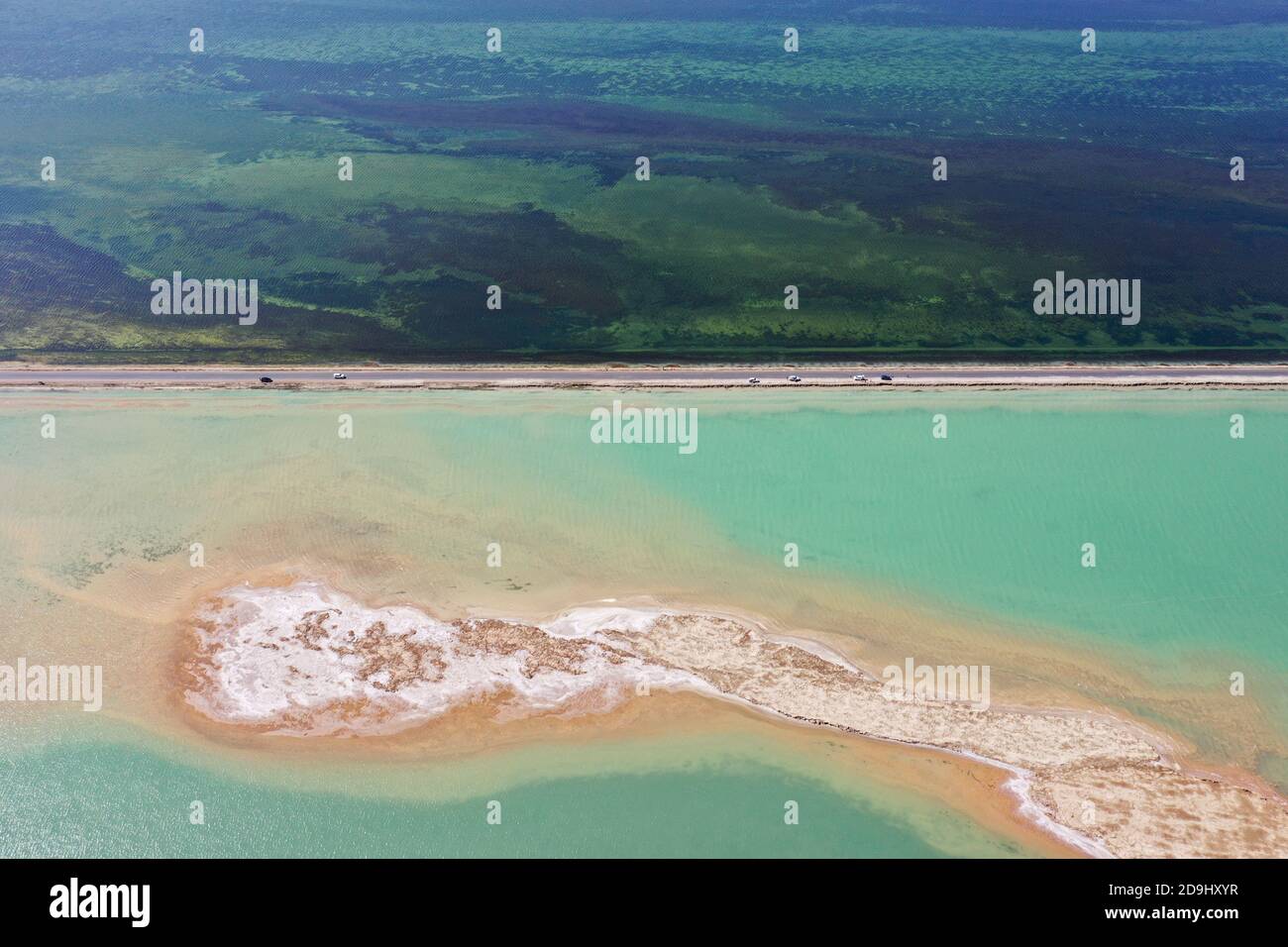 Aerial view of the °most beautiful highway over lake" in Dachaidan Town ...