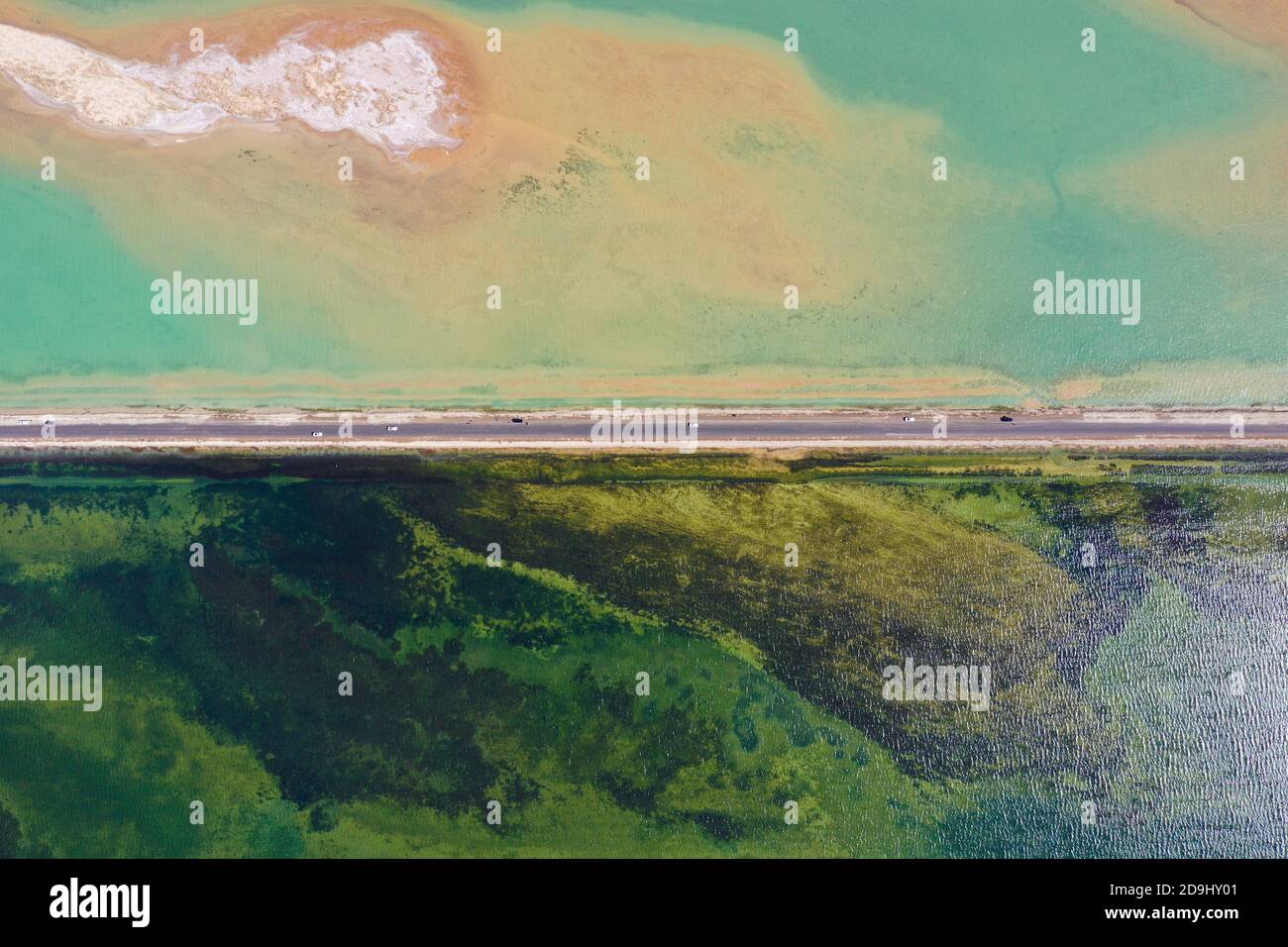 Aerial view of the °most beautiful highway over lake" in Dachaidan Town ...