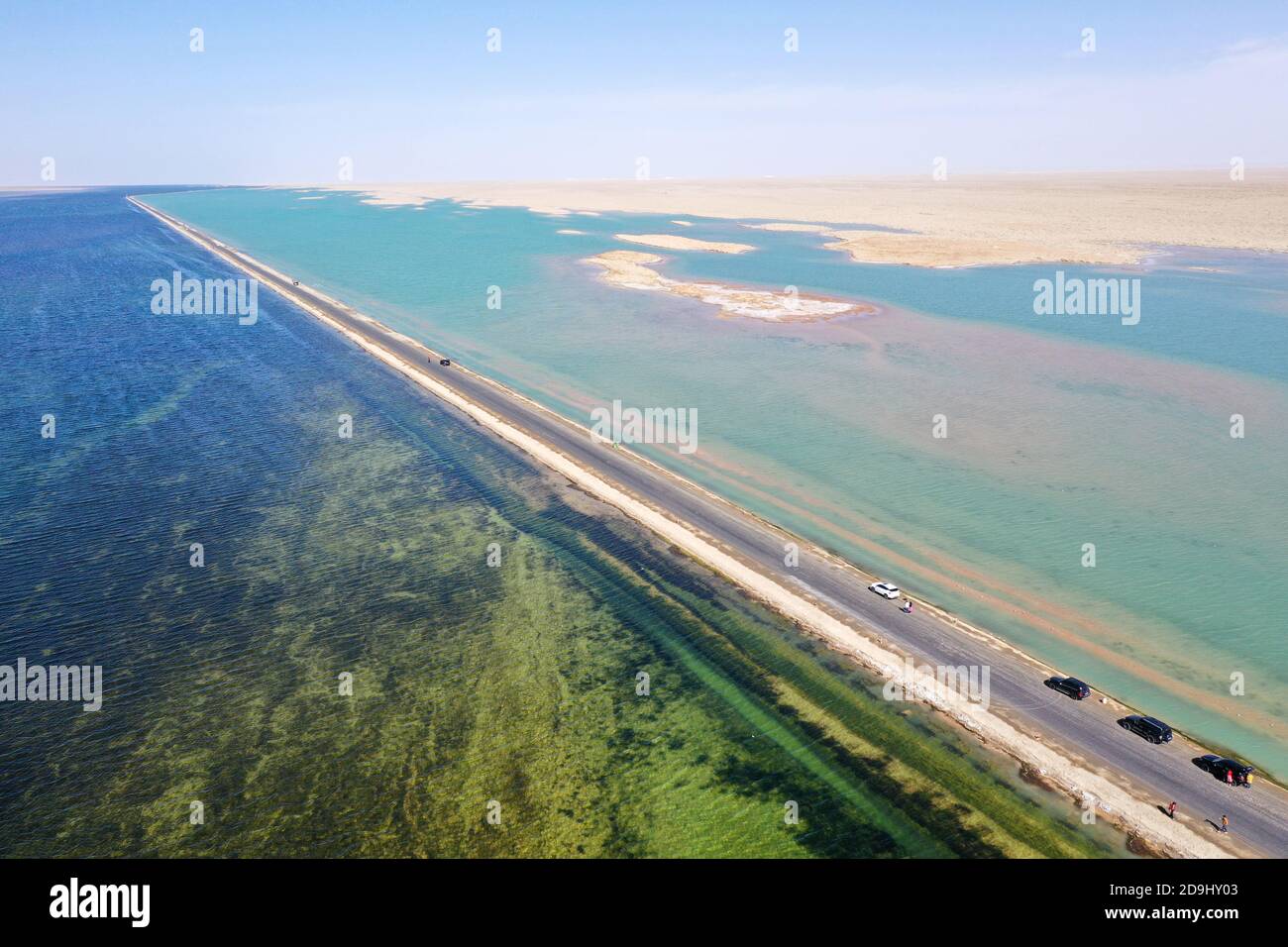Aerial view of the °most beautiful highway over lake" in Dachaidan Town ...