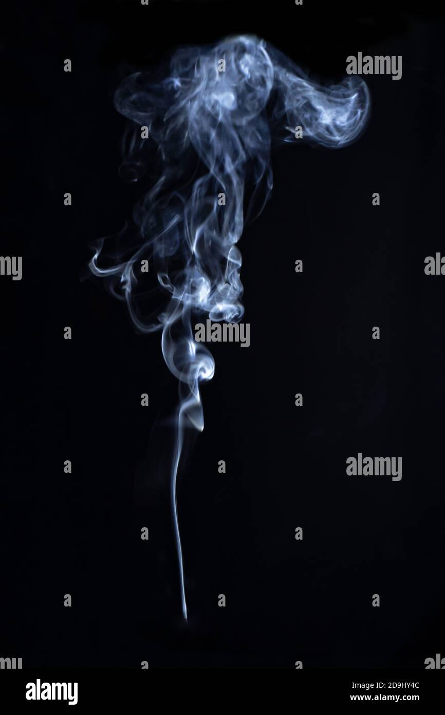 Trickle of cigarette smoke isolated on black background. Smoke curls ...
