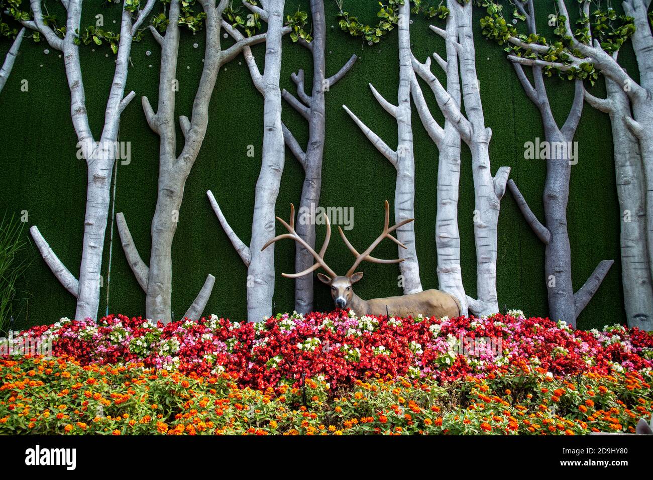 A relief wall that looks like a forest with not only trees but also ...