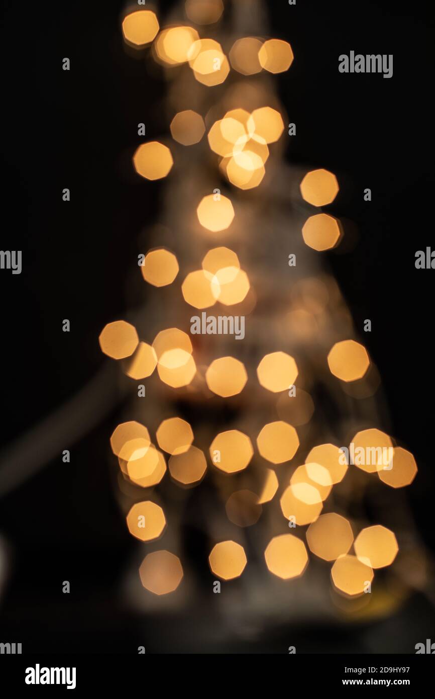 Festive bokeh light with golden yellow blurred lights, sparkling shiny ...