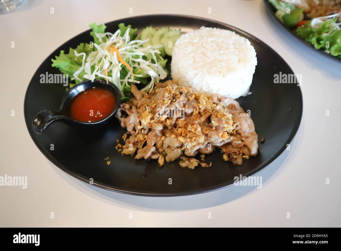 stir fried pork with garlic ,pork and rice Stock Photo - Alamy