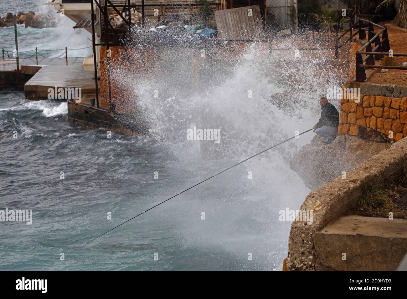 Beirut, Lebanon. 5th Nov, 2020. A man enjoys fishing at the seaside of ...