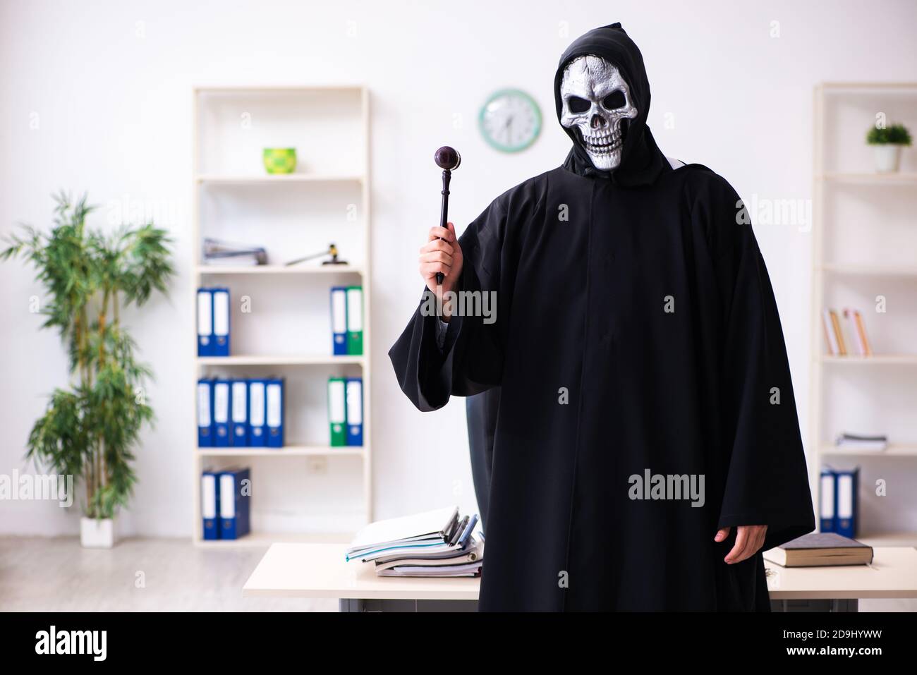 Devil judge working in the courthouse Stock Photo - Alamy