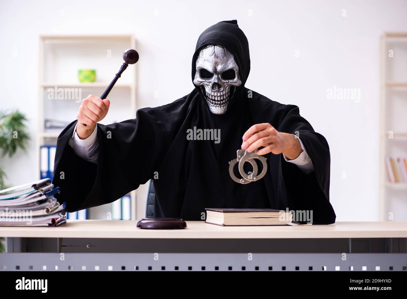 Devil judge working in the courthouse Stock Photo - Alamy
