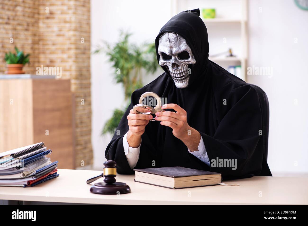 Devil judge working in the courthouse Stock Photo - Alamy