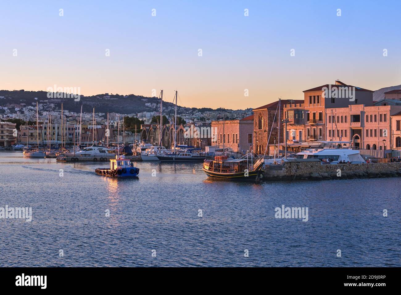 Fishing boat leaving Old Venetian port of Chania, Crete, Greece at ...