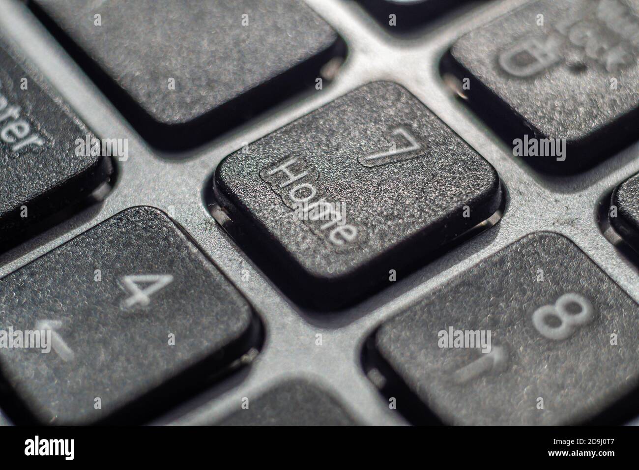 Closeup of a computer keyboard zoomed on the number 7 and Home button ...