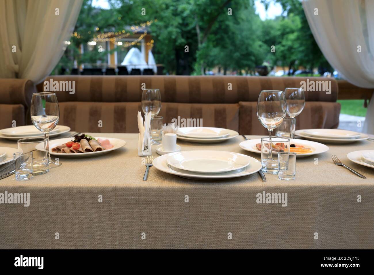 Dining table with appetizers in a restaurant Stock Photo - Alamy