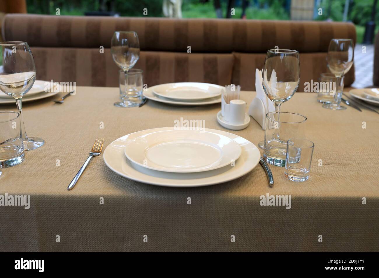 View of dining table with cutlery in a restaurant Stock Photo - Alamy