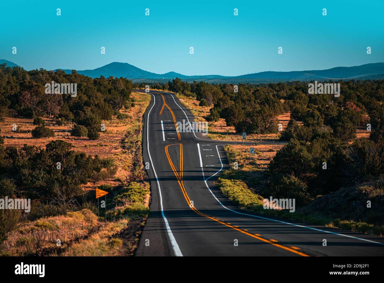 Skyline with empty road. Landscape with rocks and asphalt road in the ...