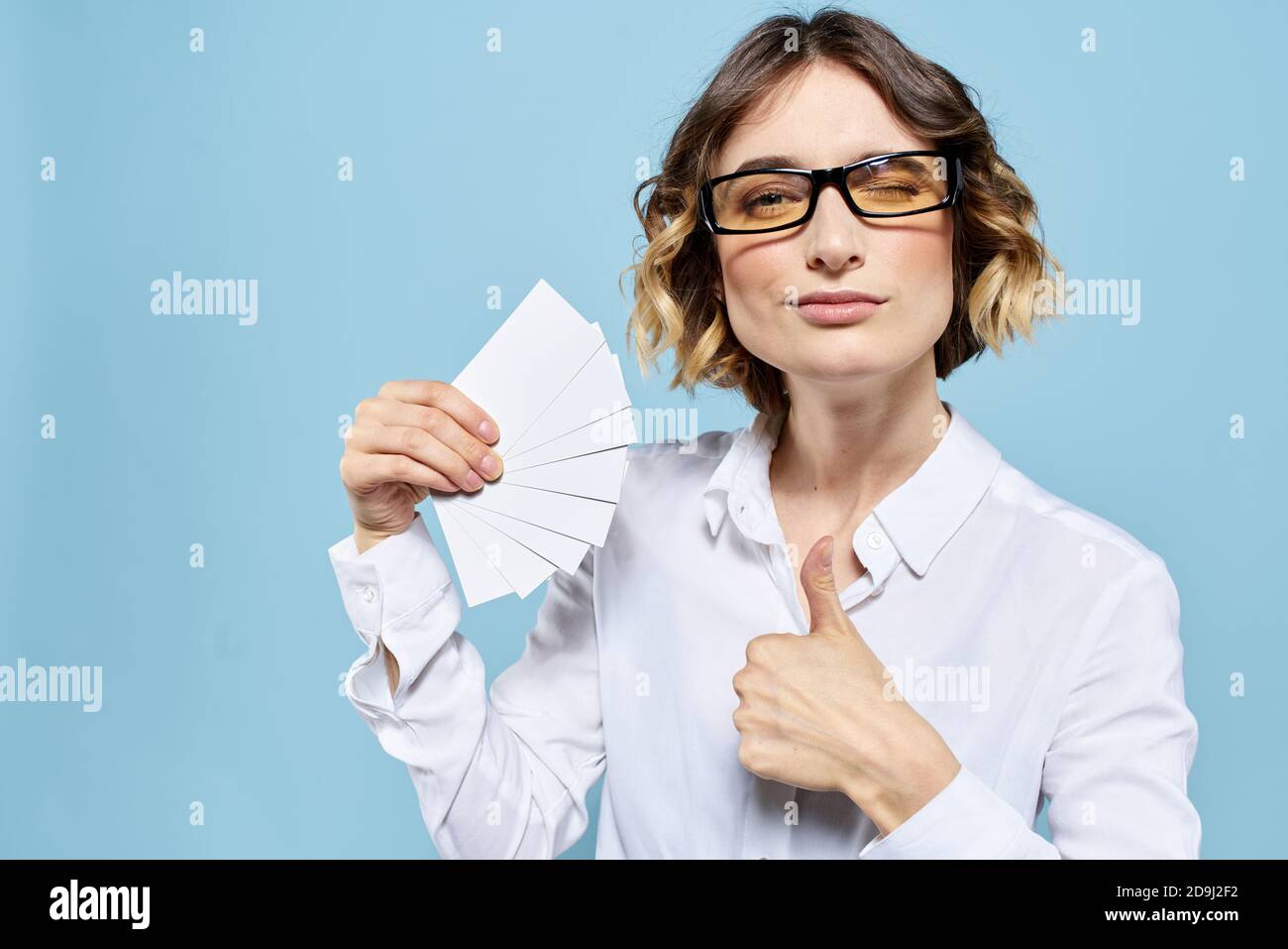 Business woman with business cards credit card blue background work ...