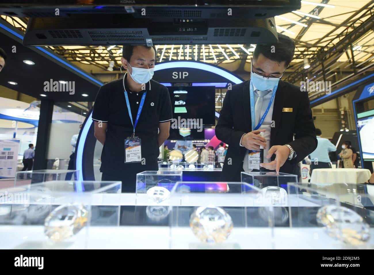 Various kinds of chips are exhibited at different booths by ...