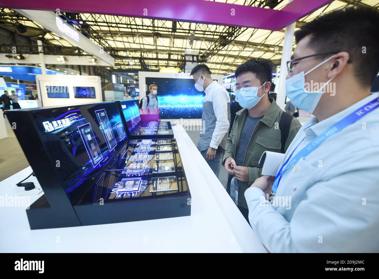 Visitors carefully observe various kinds of chips are exhibited at ...
