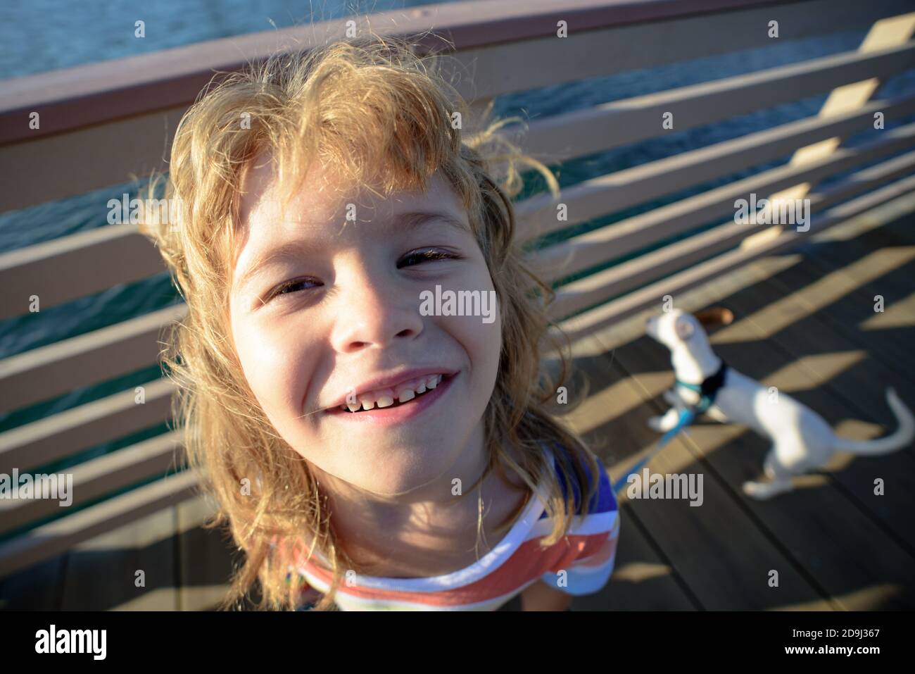 Funny smile. Closeup Kids Face. Child with Puppy Dog. Wide angle Stock ...