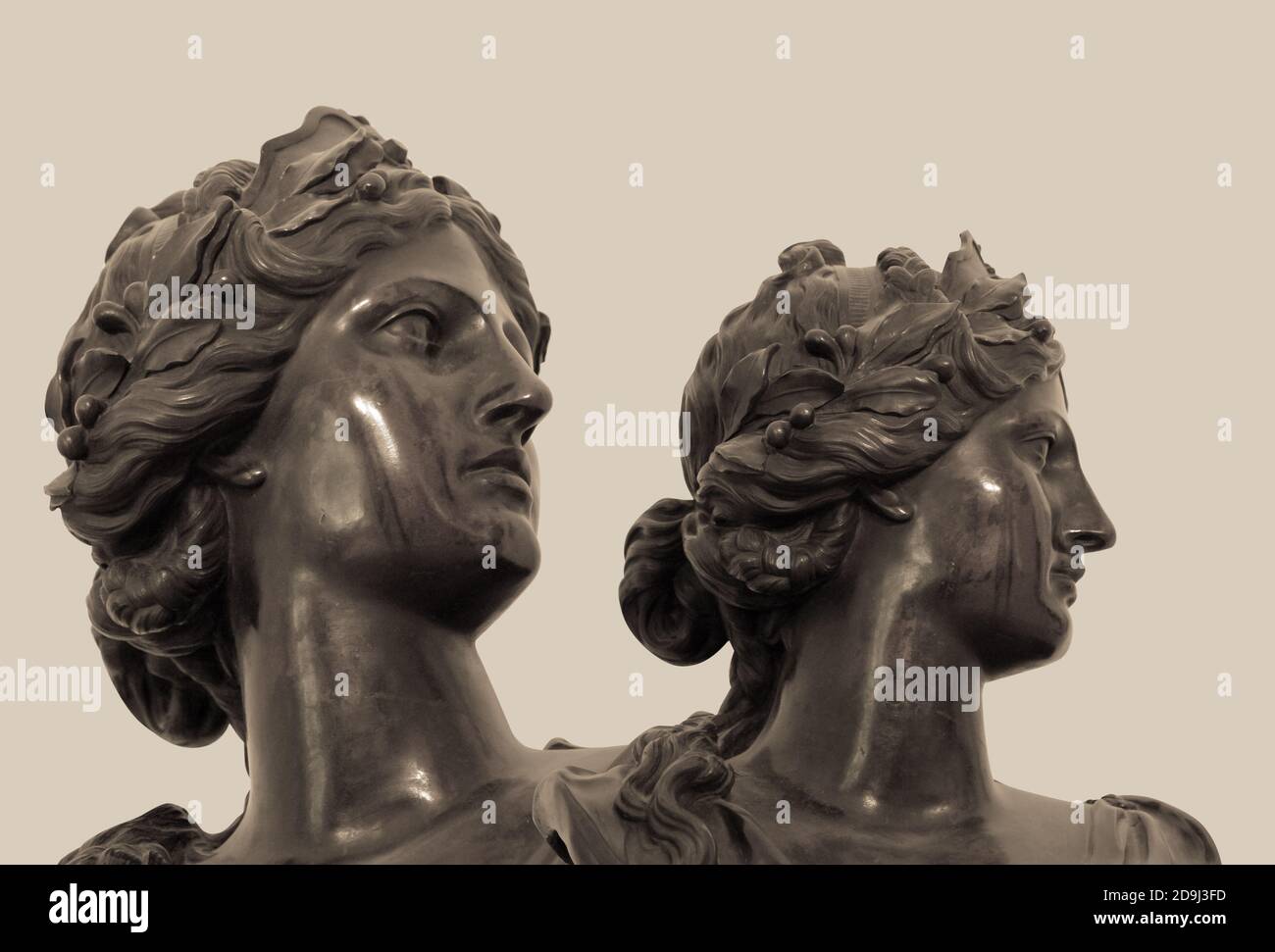 Gypsum copy of ancient statue heads on dark textured background ...