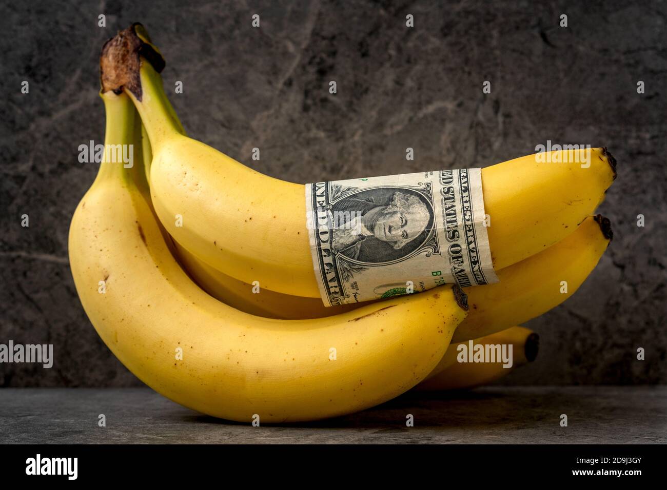 Bunch of ripe banana with american dollar. Conceptual image Stock Photo ...