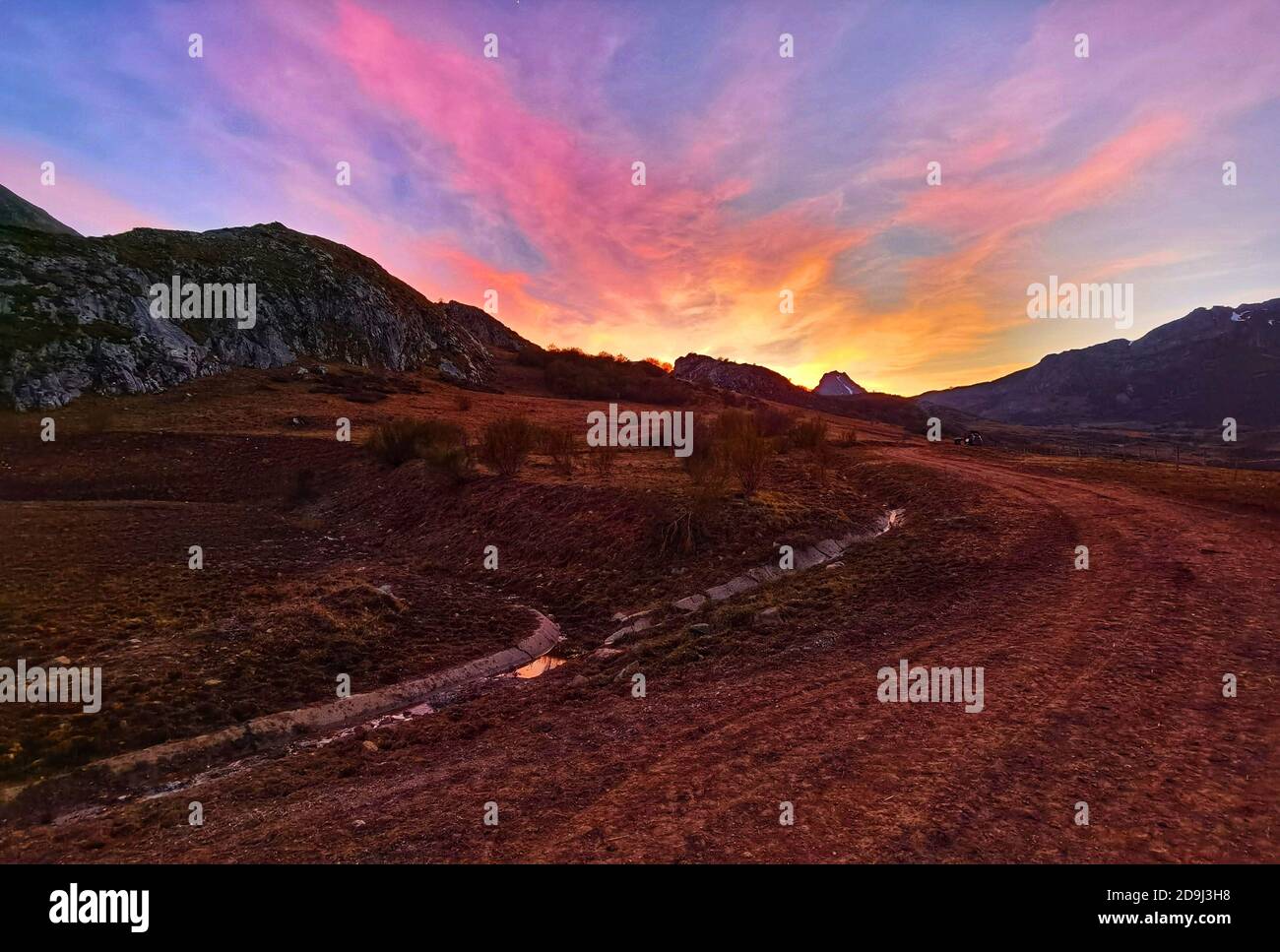Hill covered in rocks and grass under the sunlight during a beautiful ...