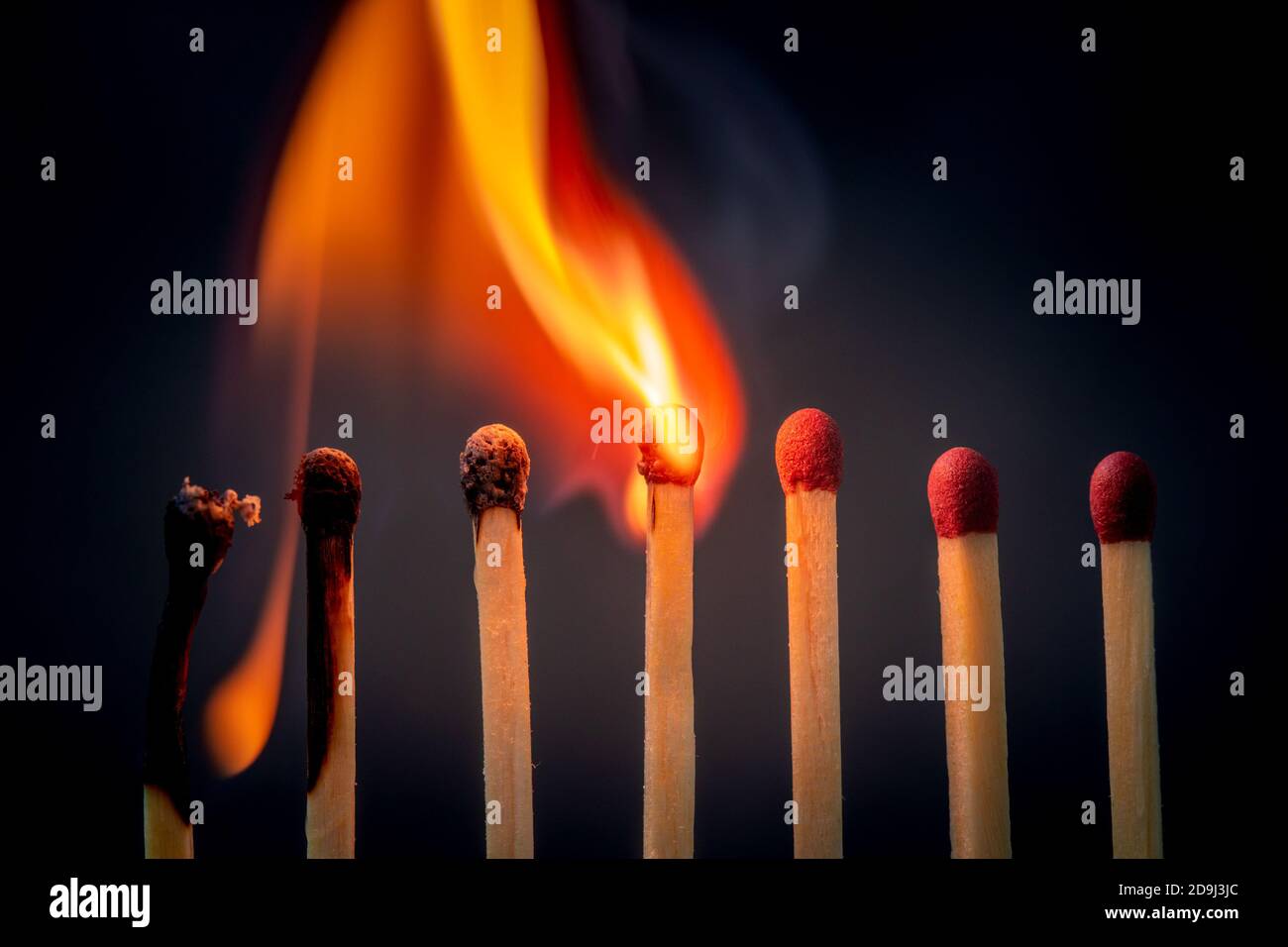 A beauty of burning matches, isolated in dark background. Fire styling ...