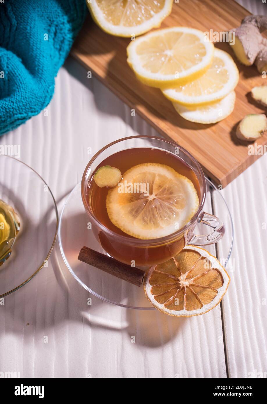 Vitamin tea with lemon and ginger in a glass Cup, white background ...