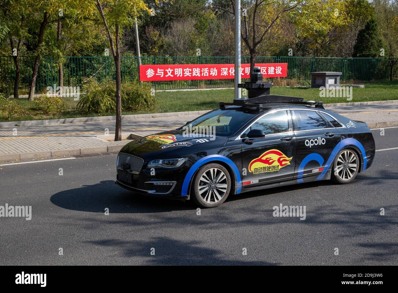 An Apollo Go Robotaxi drives on a road in Beijing, China, 14 OCtober ...