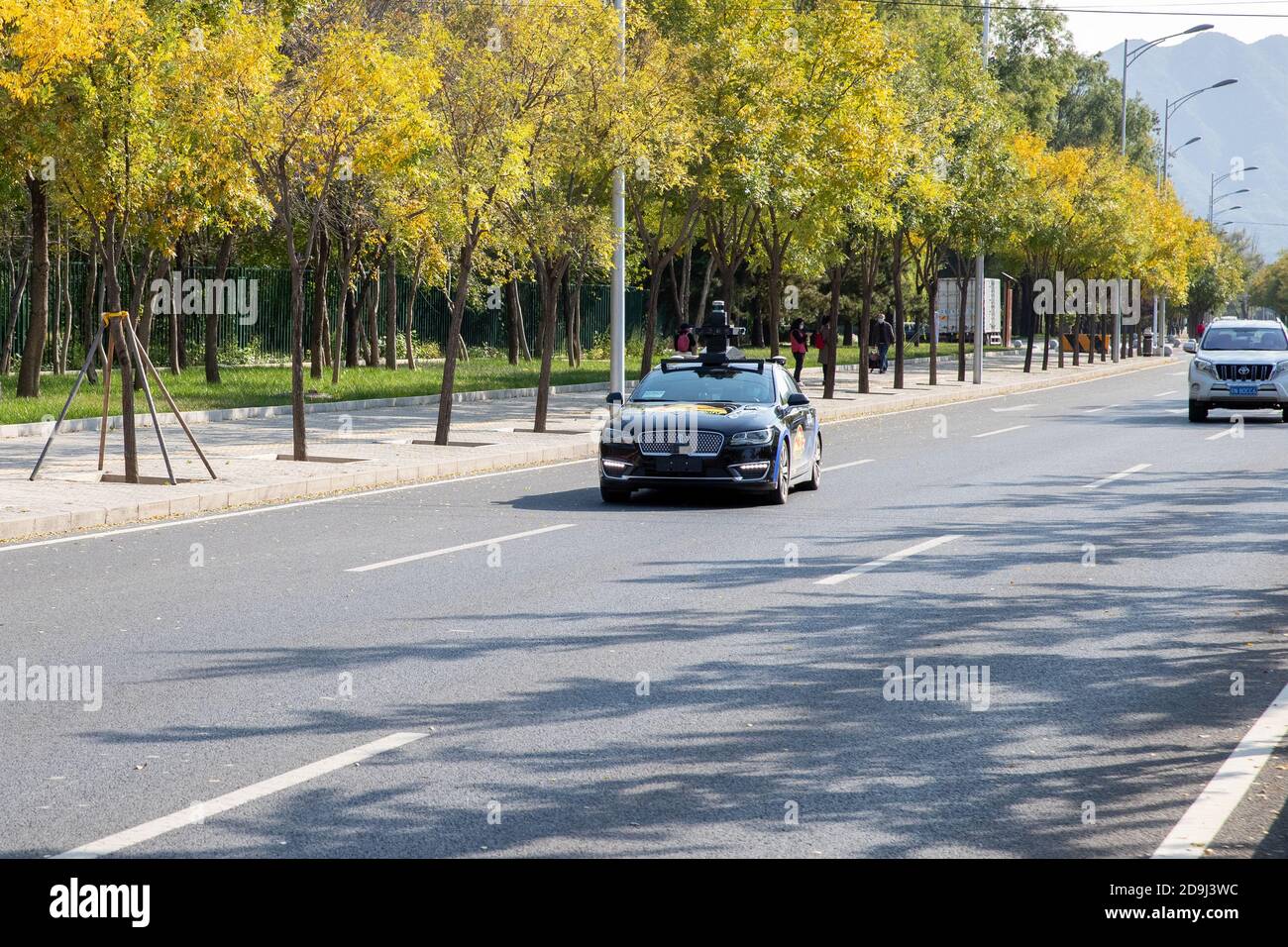 An Apollo Go Robotaxi drives on a road in Beijing, China, 14 OCtober ...