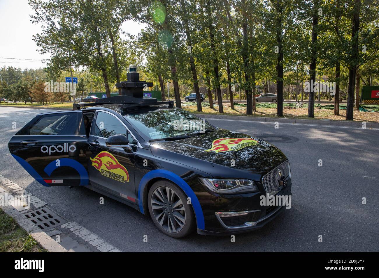 An Apollo Go Robotaxi drives on a road in Beijing, China, 14 OCtober ...