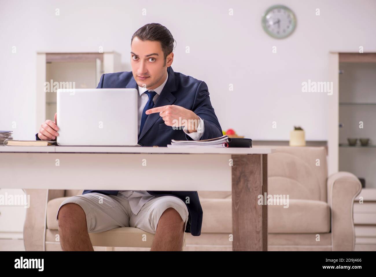 Male employee working at home during pandemic disease Stock Photo - Alamy