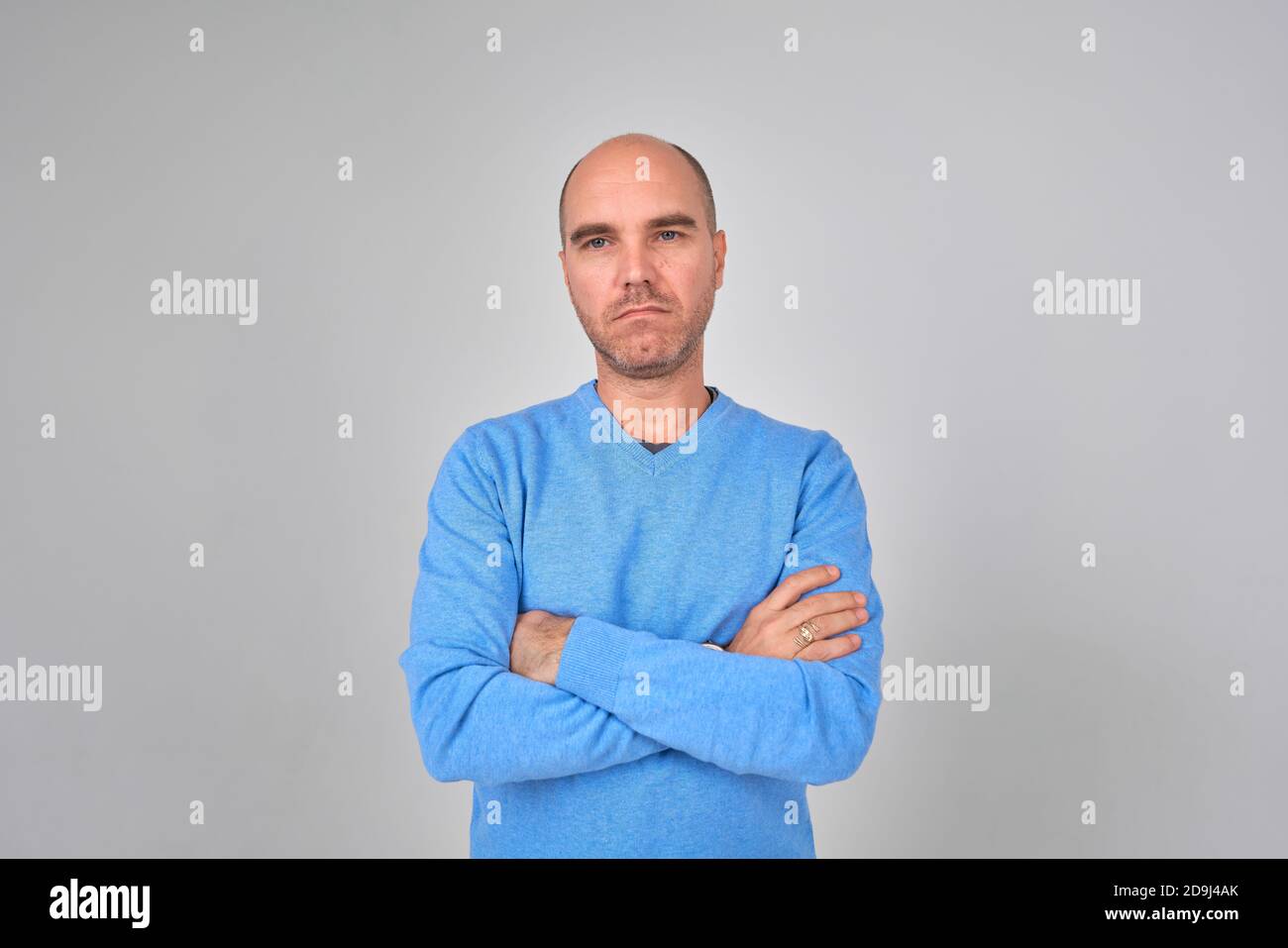 Casual handsome man smiling at camera, hands in pocket Stock Photo - Alamy