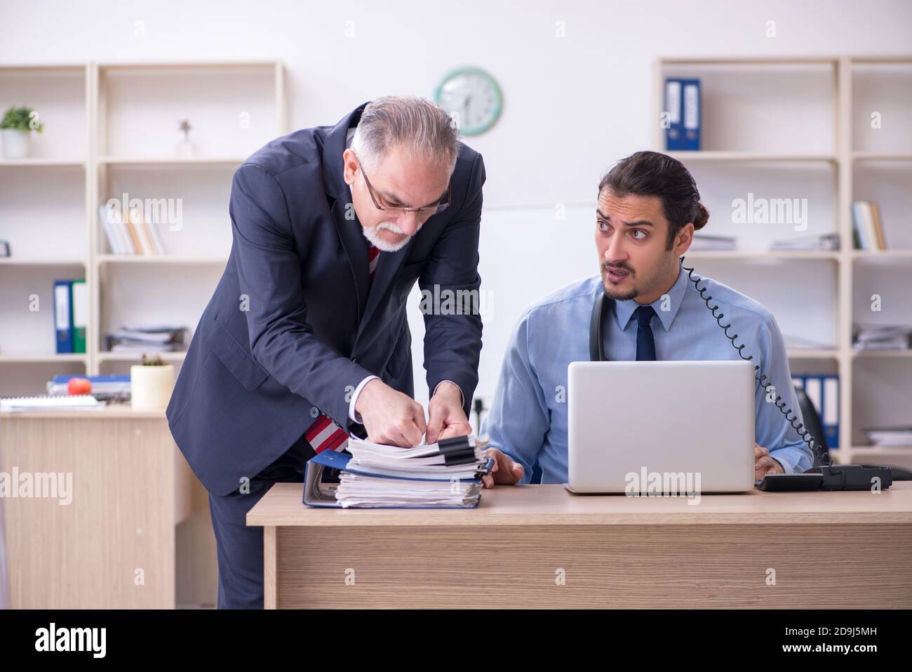 Two employees in the office environment Stock Photo - Alamy